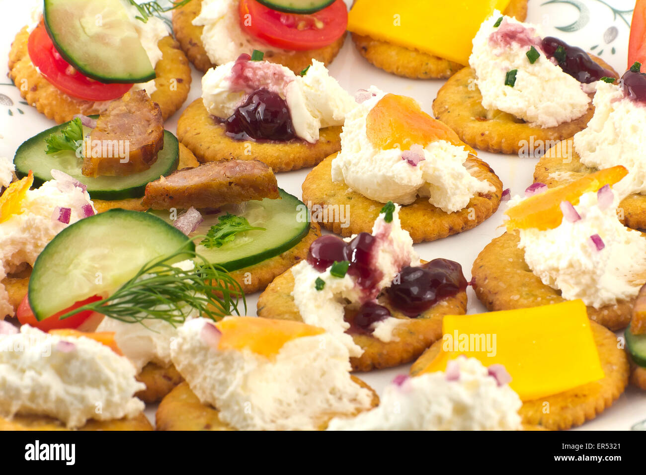 Assorted canopes, appetizer crackers with toppings Stock Photo - Alamy