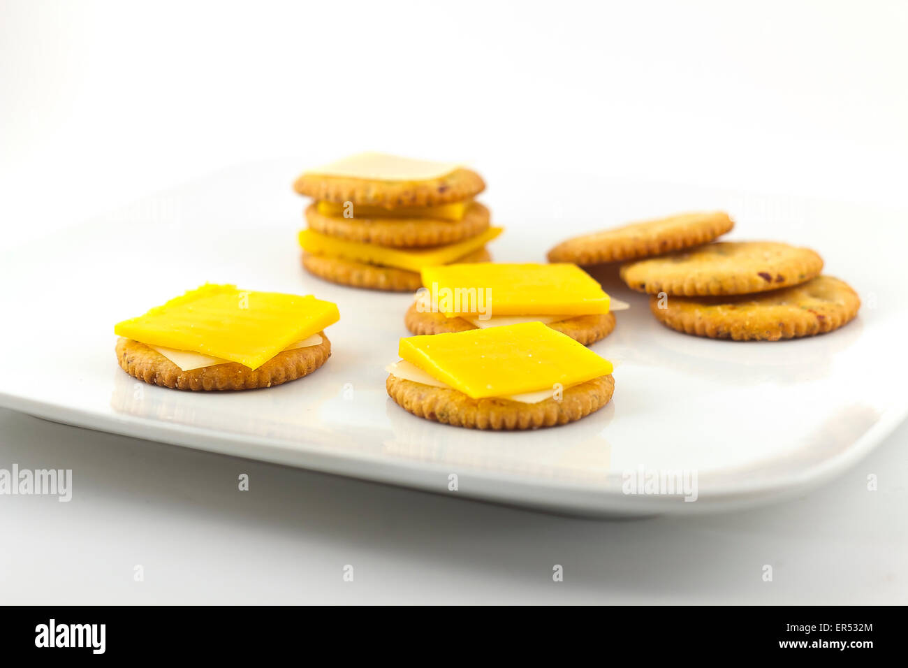 Snack plate of crackers and yellow and white cheddar cheese Stock Photo ...