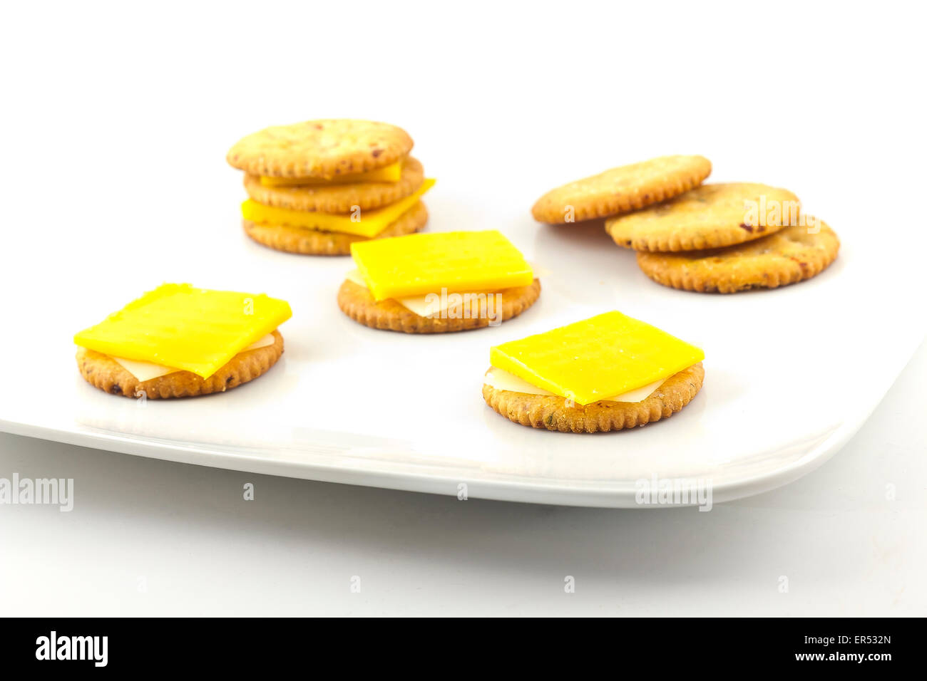 Snack plate of crackers and yellow and white cheddar cheese Stock Photo ...
