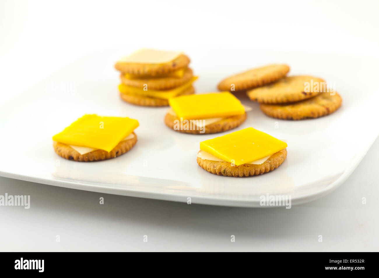 Snack plate of crackers and yellow and white cheddar cheese Stock Photo ...