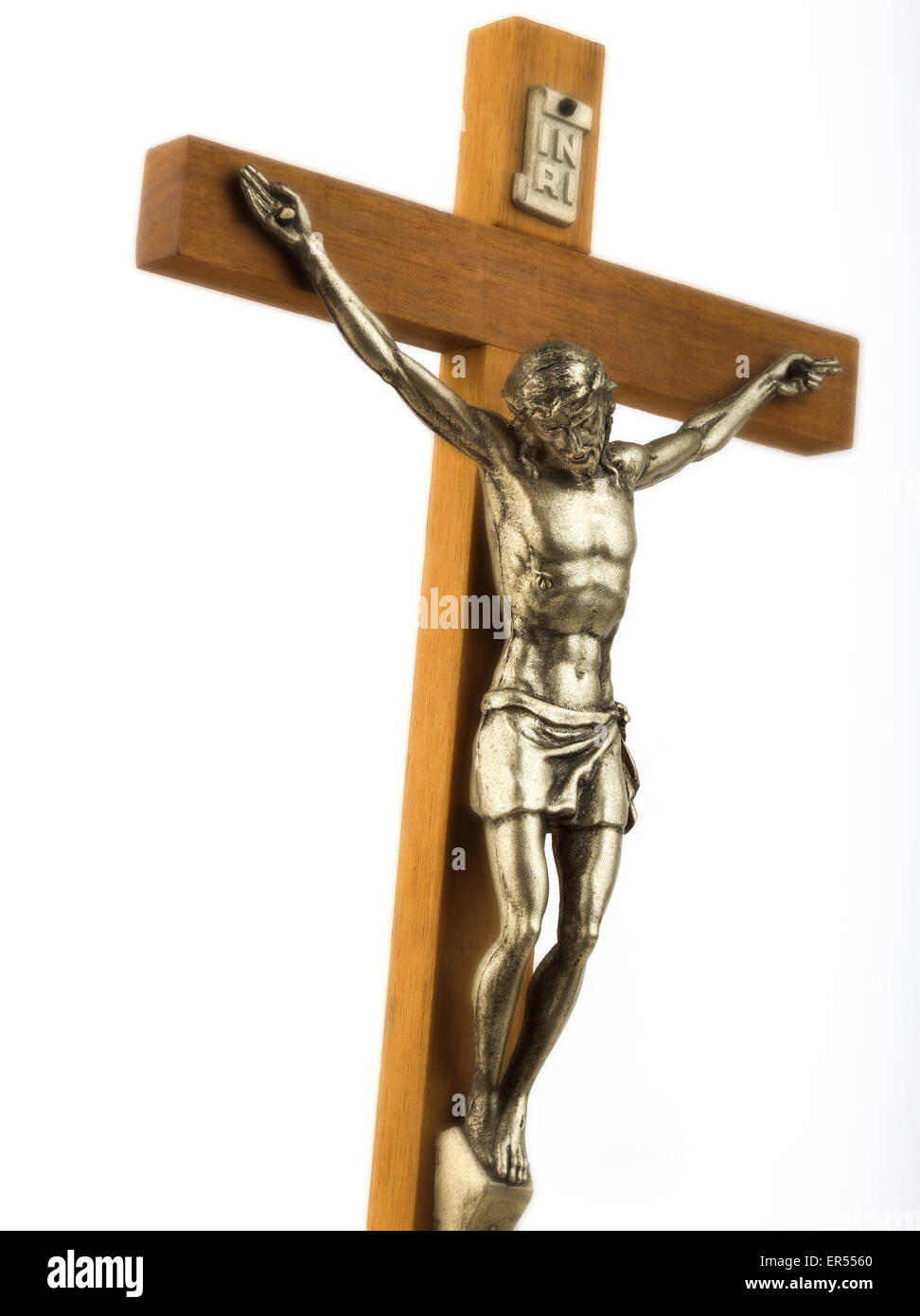 Wooden crucifix with effigy of Christ, closeup, with glow effect ...