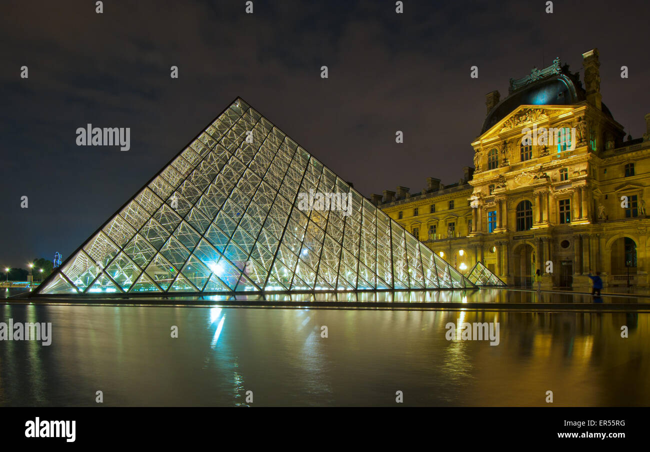 PARIS, FRANCE - July, 22, 2011: Louvre museum at night. The Louvre is ...