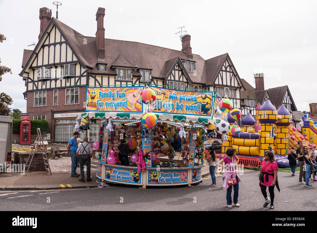 Pinner, London, UK. 27 May 2015. Modern rides and stalls contrast with ...