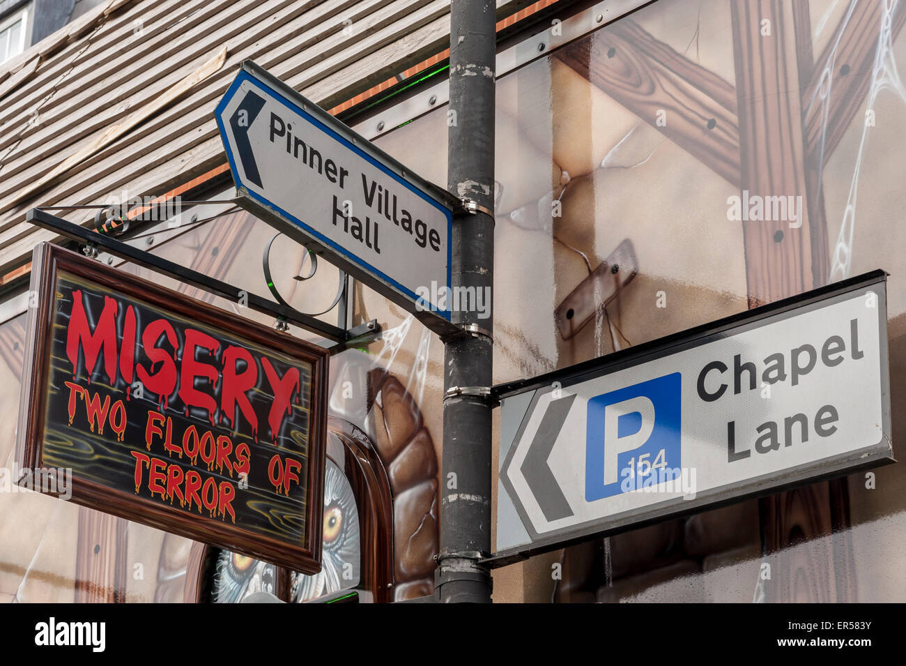 Pinner, London, UK. 27 May 2015. Existing road signs jostle for ...