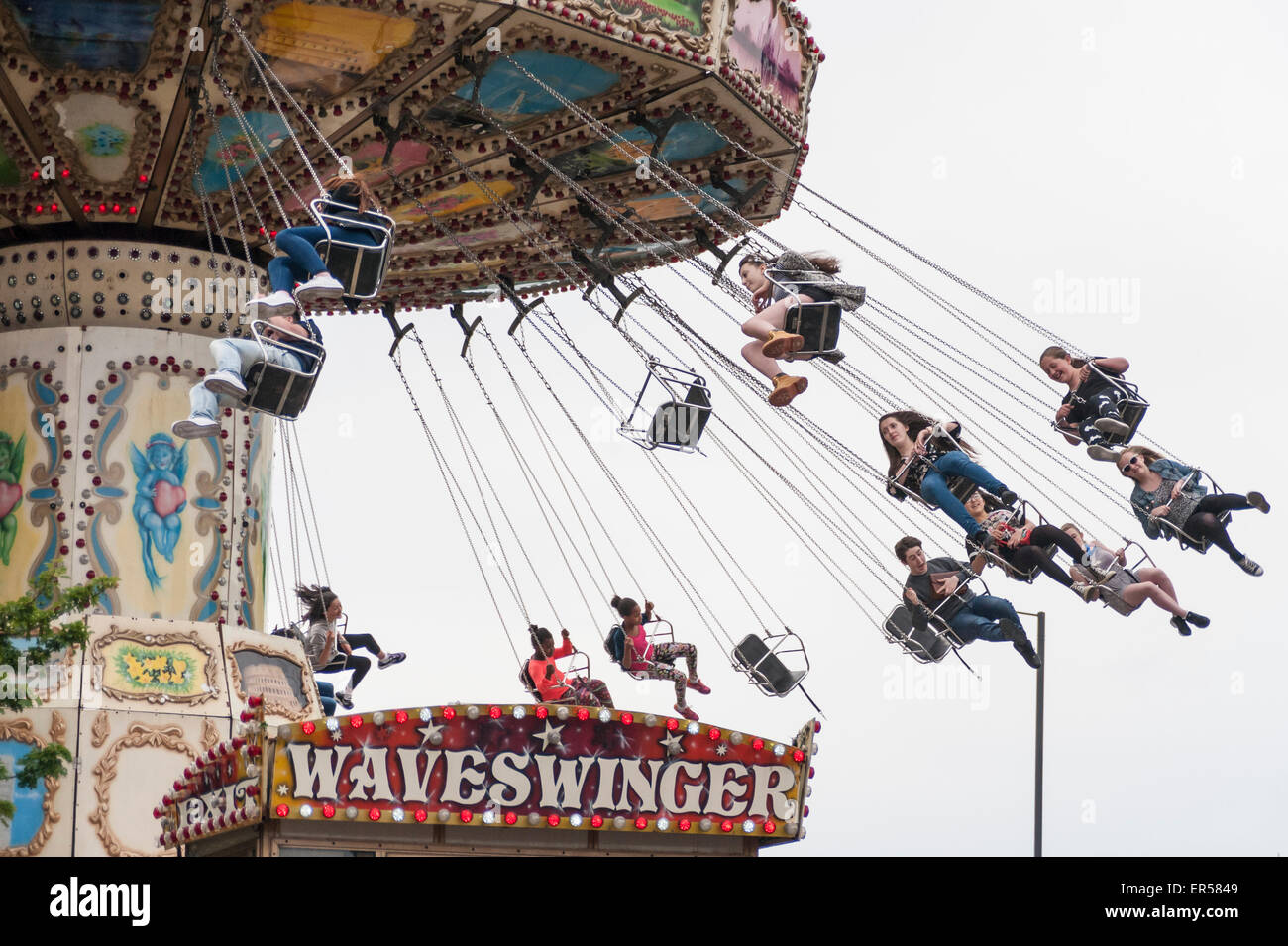 Pinner, London, UK. 27 May 2015. Children brave the Waveswinger ride ...