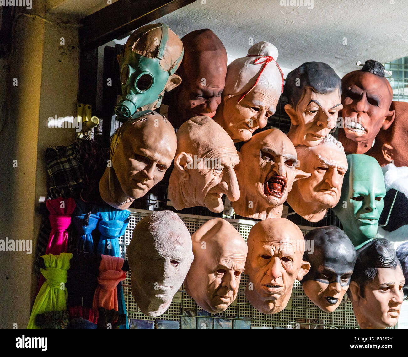 latex monster masks hanging in rows Stock Photo - Alamy