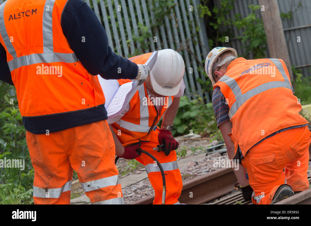 Railway workers from Signalling Solutions and Alstom working trackside ...