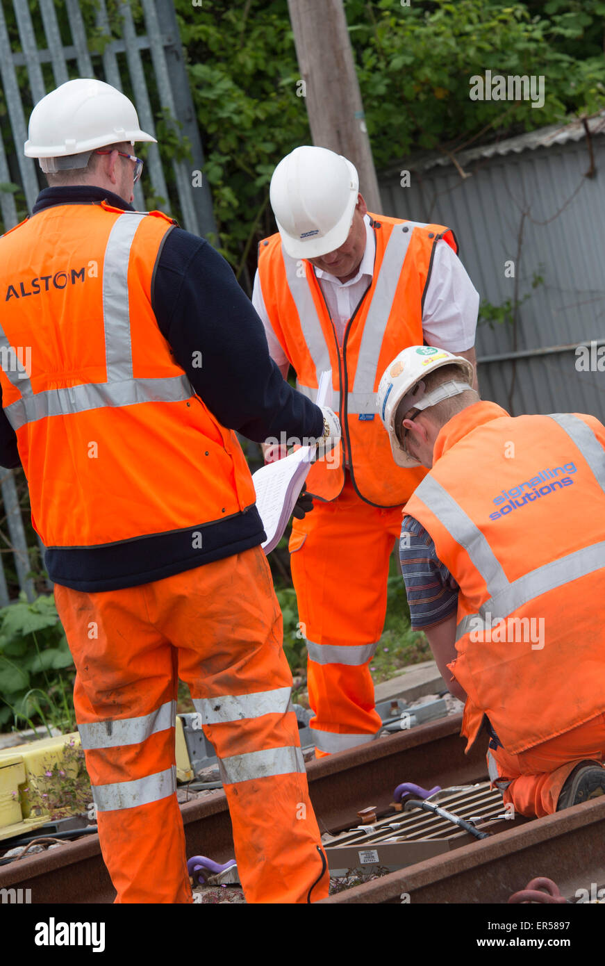 Railway workers from Signalling Solutions and Alstom working trackside ...