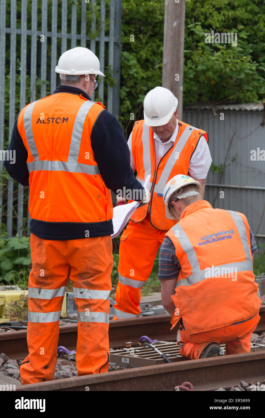 Railway workers from Signalling Solutions and Alstom working trackside ...