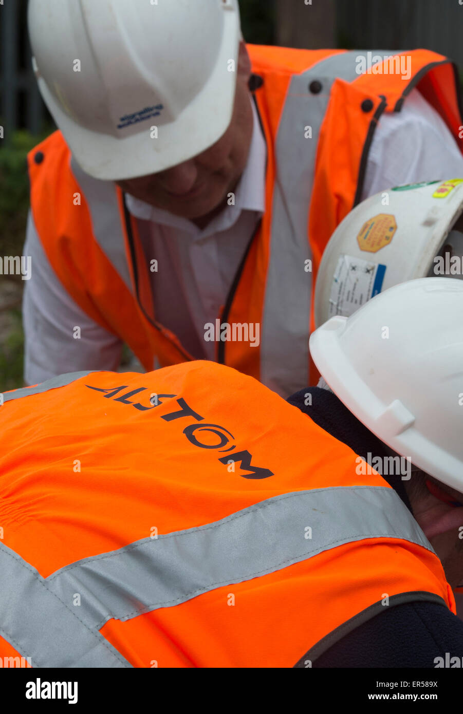 Railway workers from Signalling Solutions and Alstom working trackside ...
