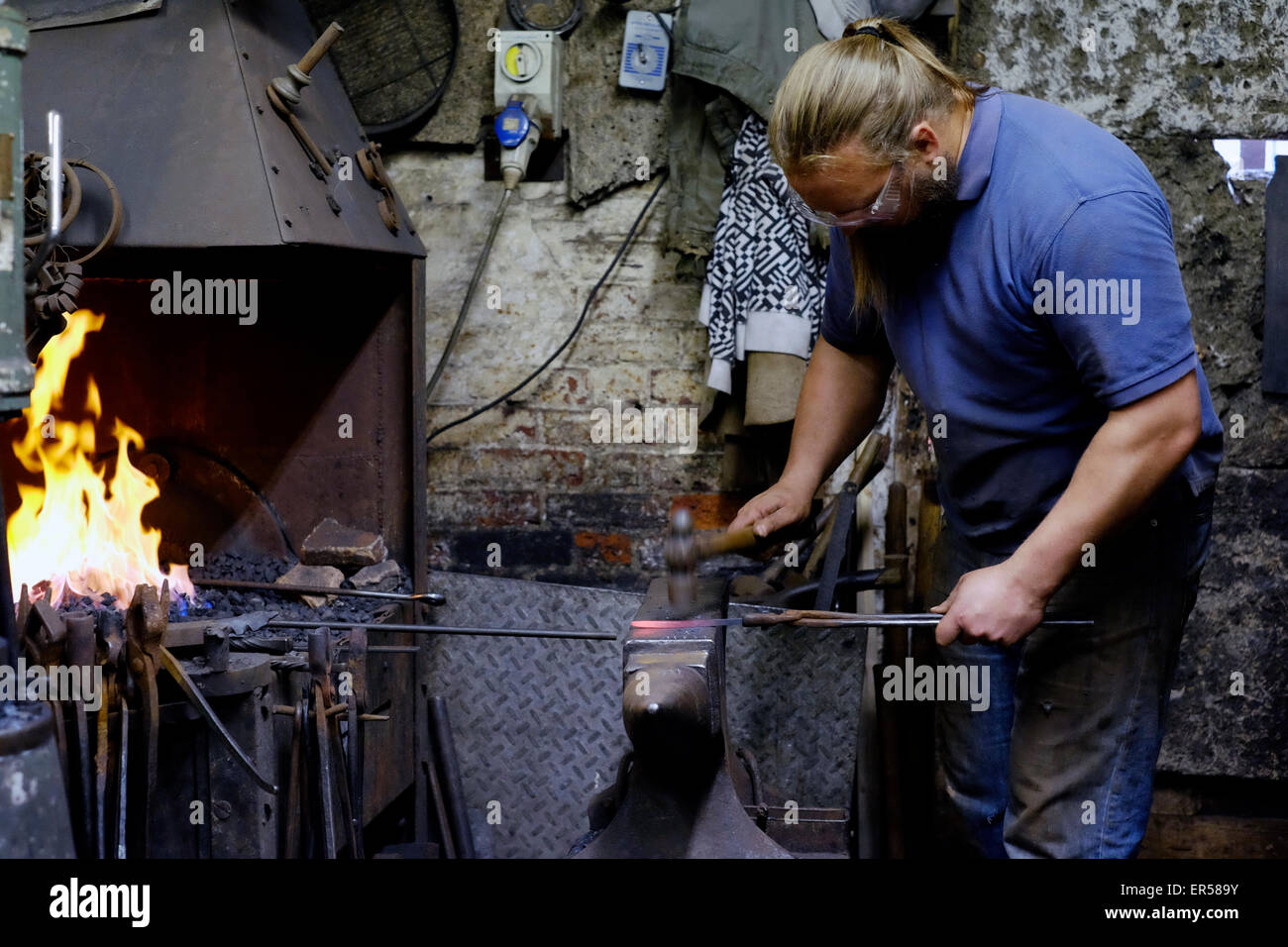 a blacksmith at work in his forge in southsea england uk Stock Photo ...