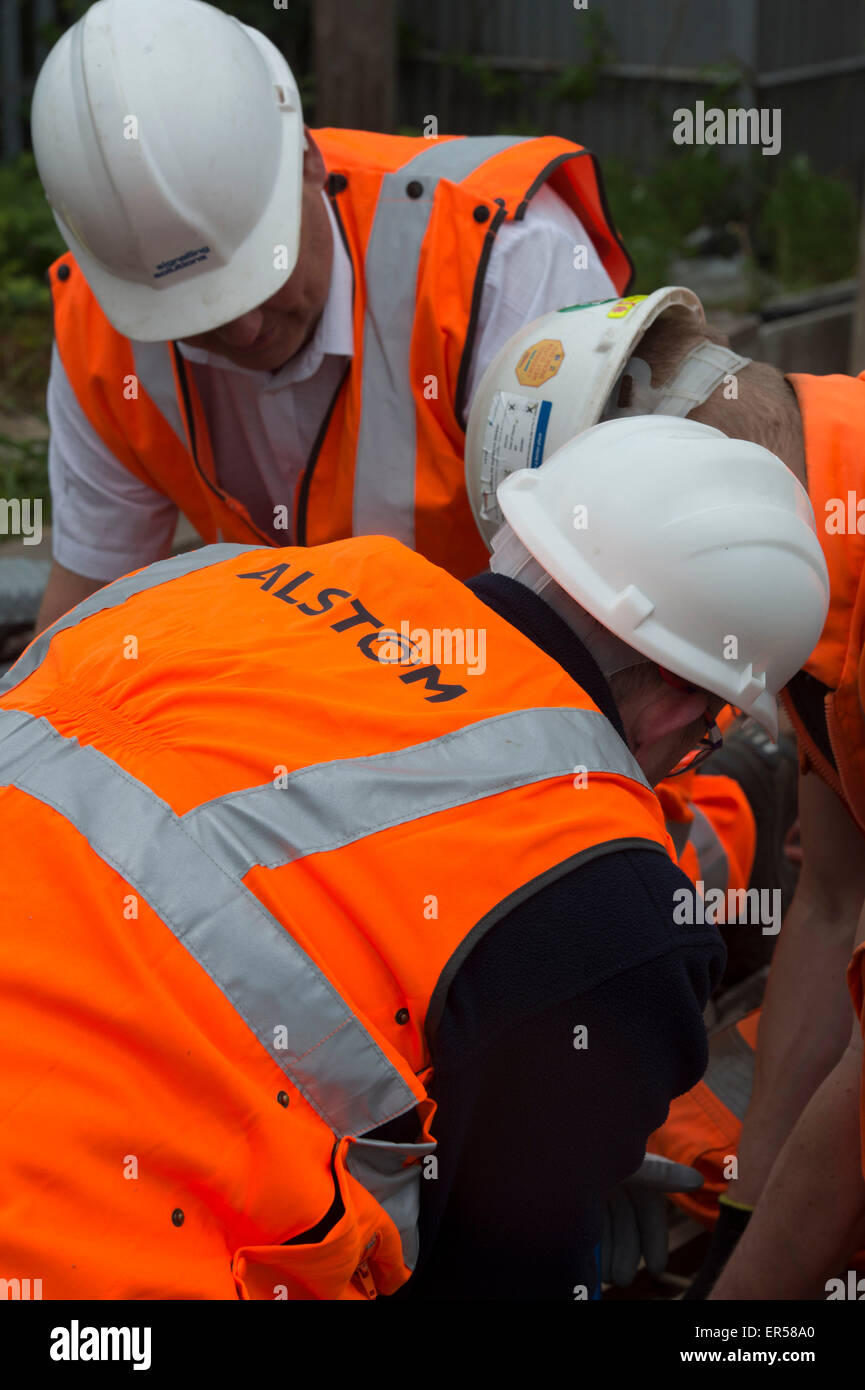 Railway workers from Signalling Solutions and Alstom working trackside ...