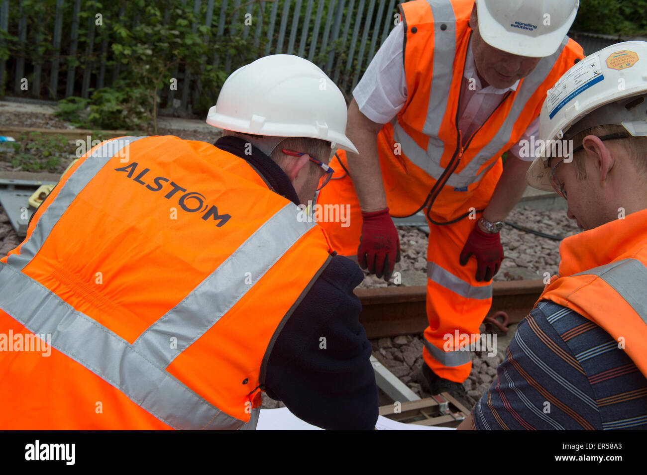 Railway workers from Signalling Solutions and Alstom working trackside ...