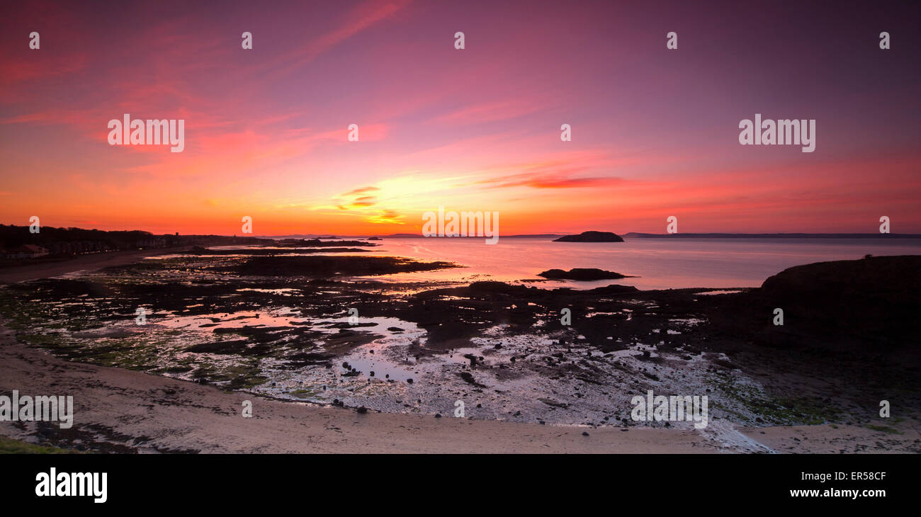A coastal view at sunset at North Berwick in Scotland looking out over ...