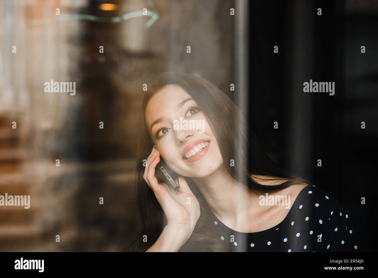Beautiful girl talking on the phone and smiling Stock Photo - Alamy