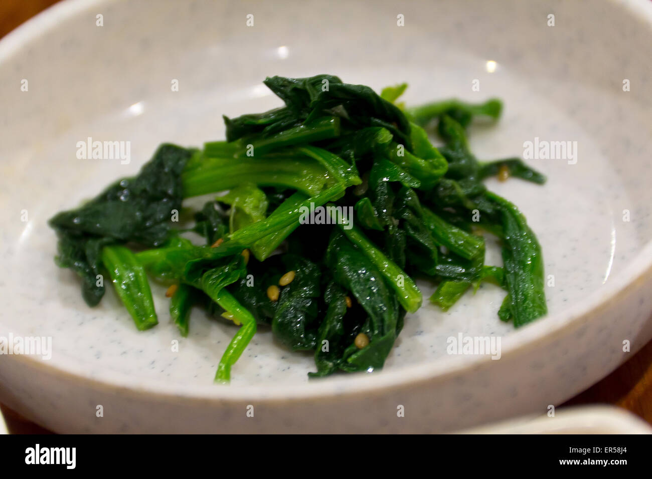 Namul namuru sauteed korean green cabbage with sesame seeds Stock Photo ...