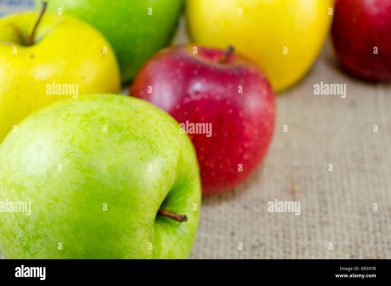 Yellow red and green apples arranged together Stock Photo - Alamy