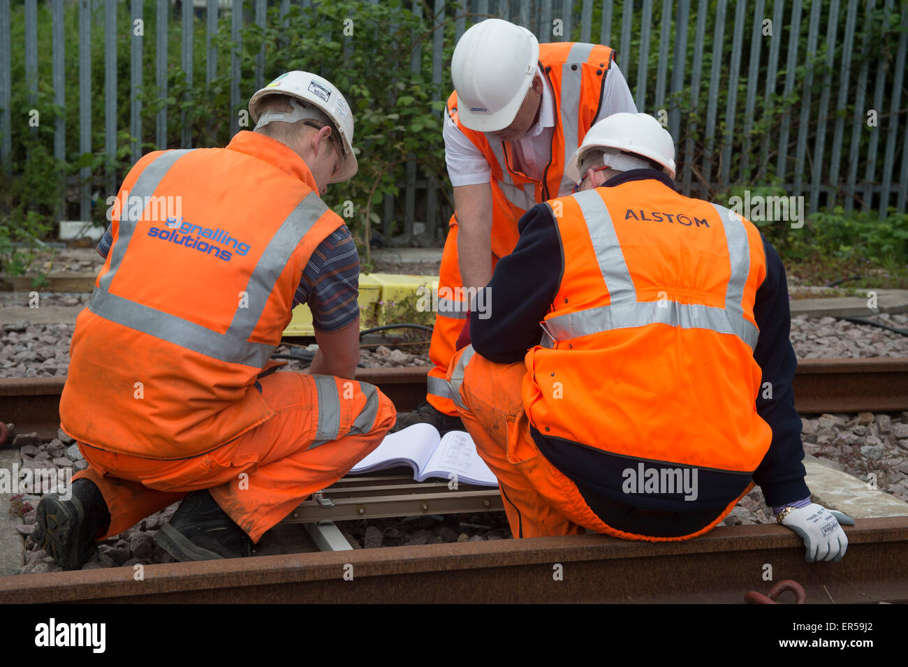 Railway workers from Signalling Solutions and Alstom working trackside ...