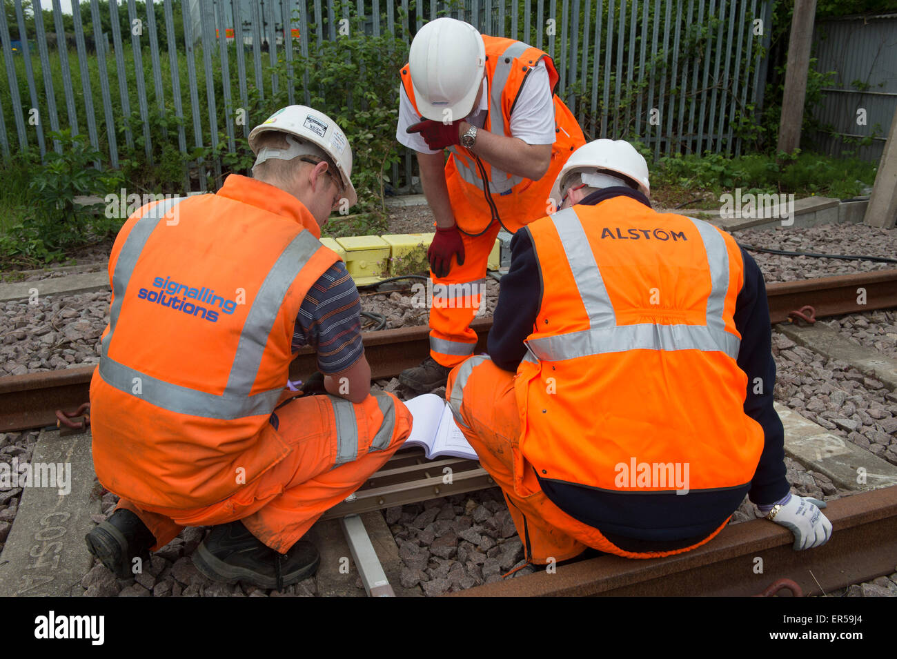 Railway workers from Signalling Solutions and Alstom working trackside ...