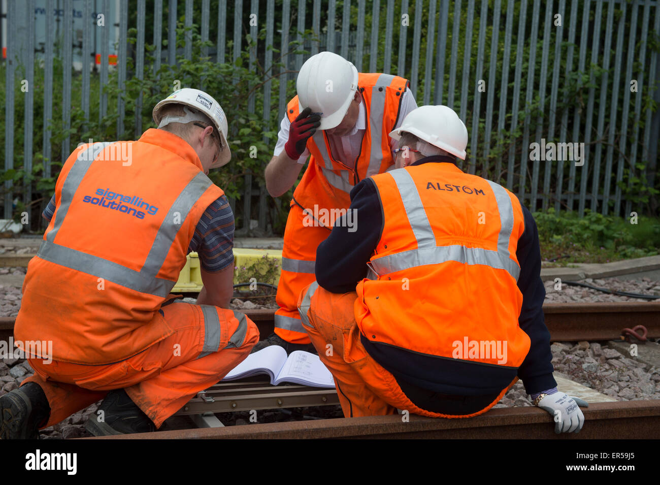Railway workers from Signalling Solutions and Alstom working trackside ...