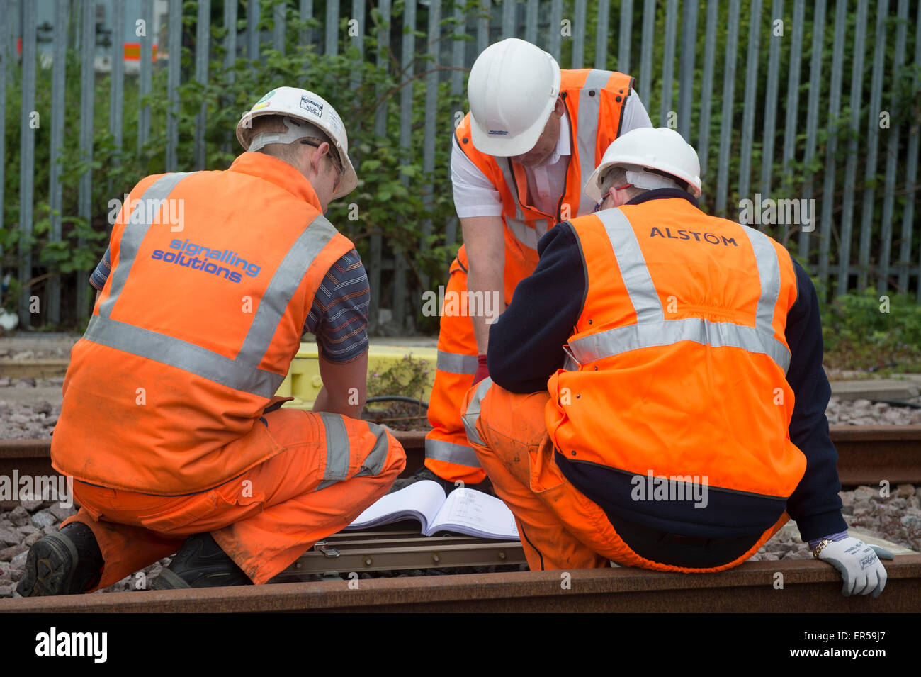 Railway workers from Signalling Solutions and Alstom working trackside ...