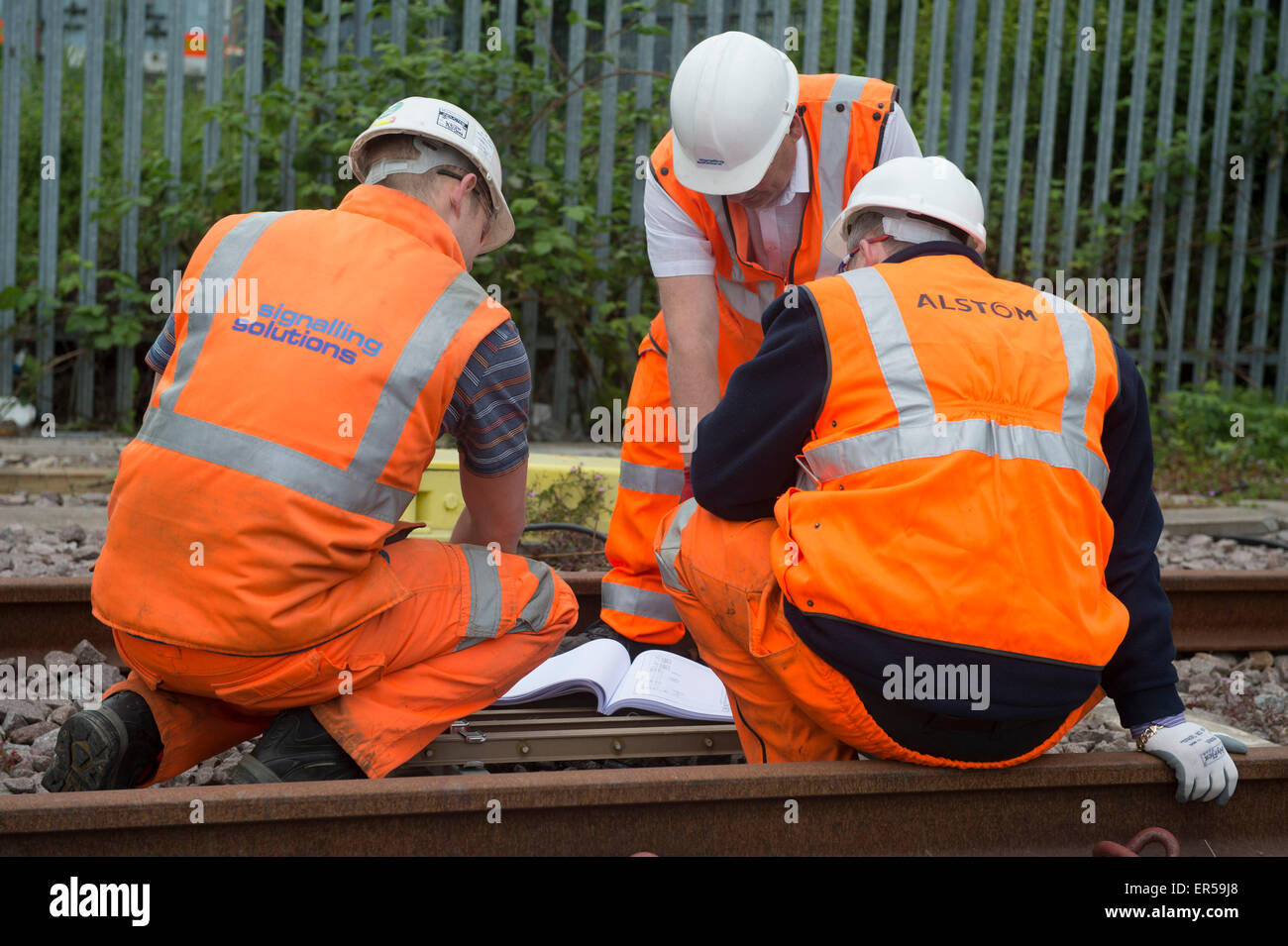 Railway workers from Signalling Solutions and Alstom working trackside ...