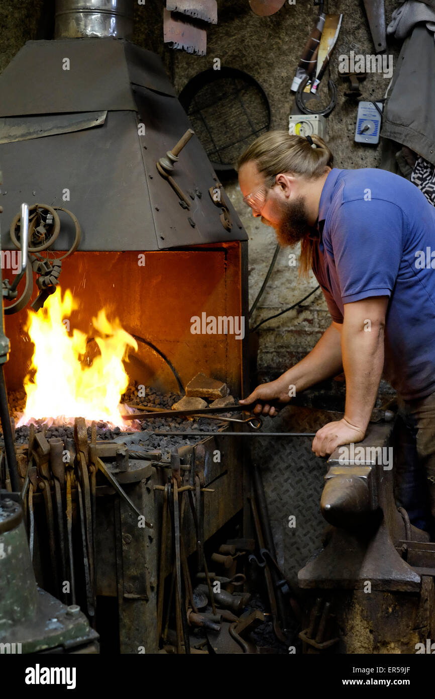 a blacksmith at work in his forge in southsea england uk Stock Photo ...