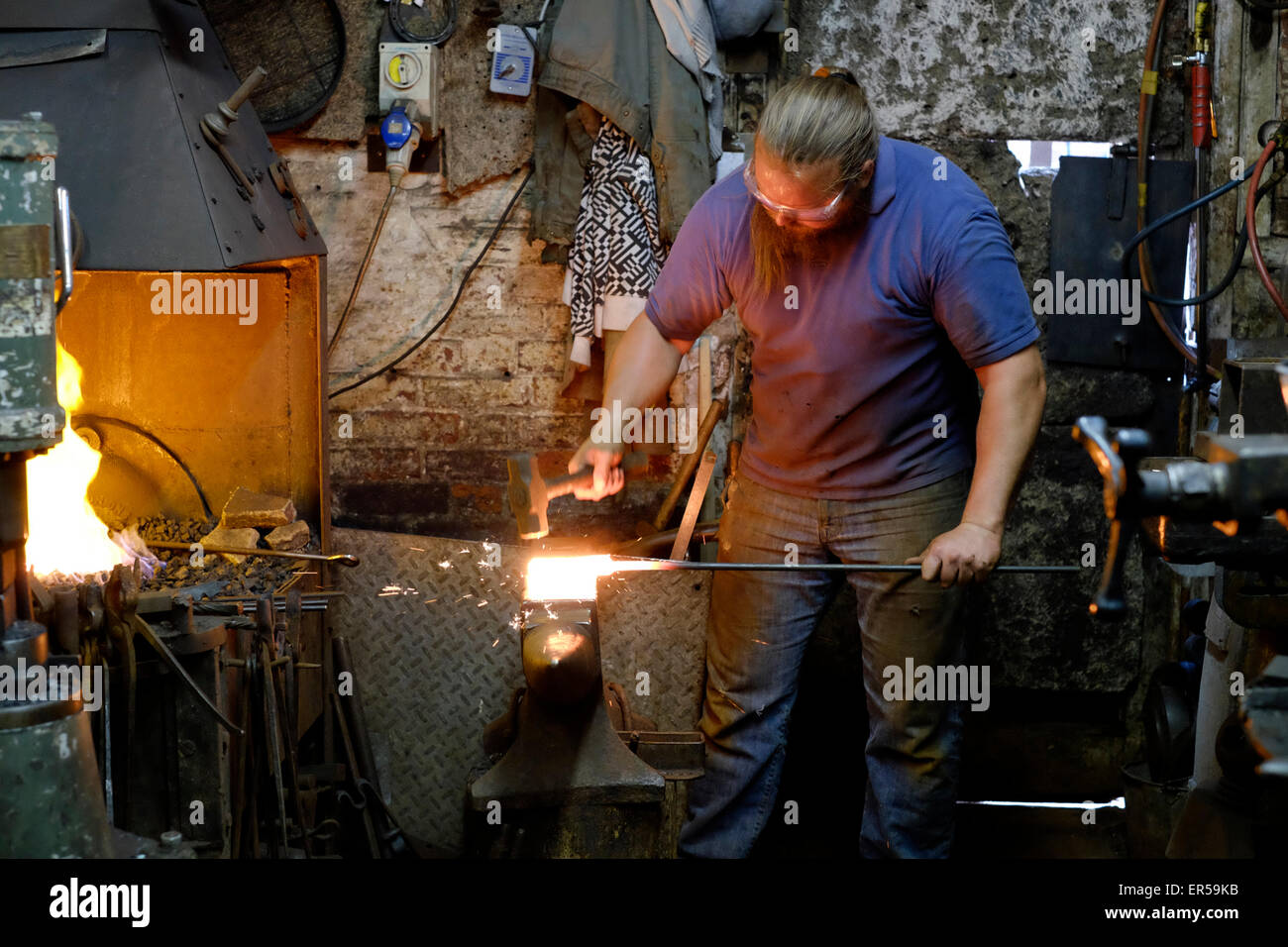 a blacksmith at work in his forge in southsea england uk Stock Photo ...