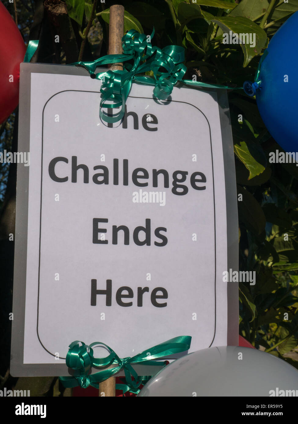 Sign saying The Challenge Ends Here Stock Photo - Alamy