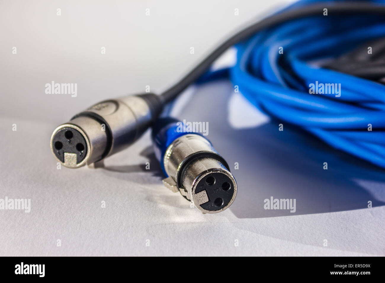 XLR cables and connections details. Poster background blue Stock Photo ...