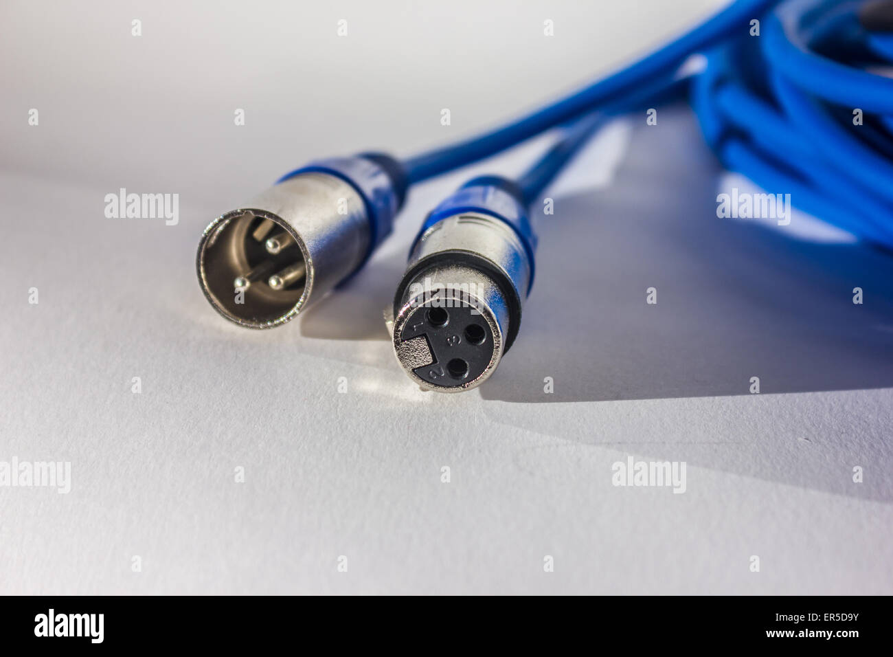 XLR cables and connections details. Poster background blue Stock Photo ...