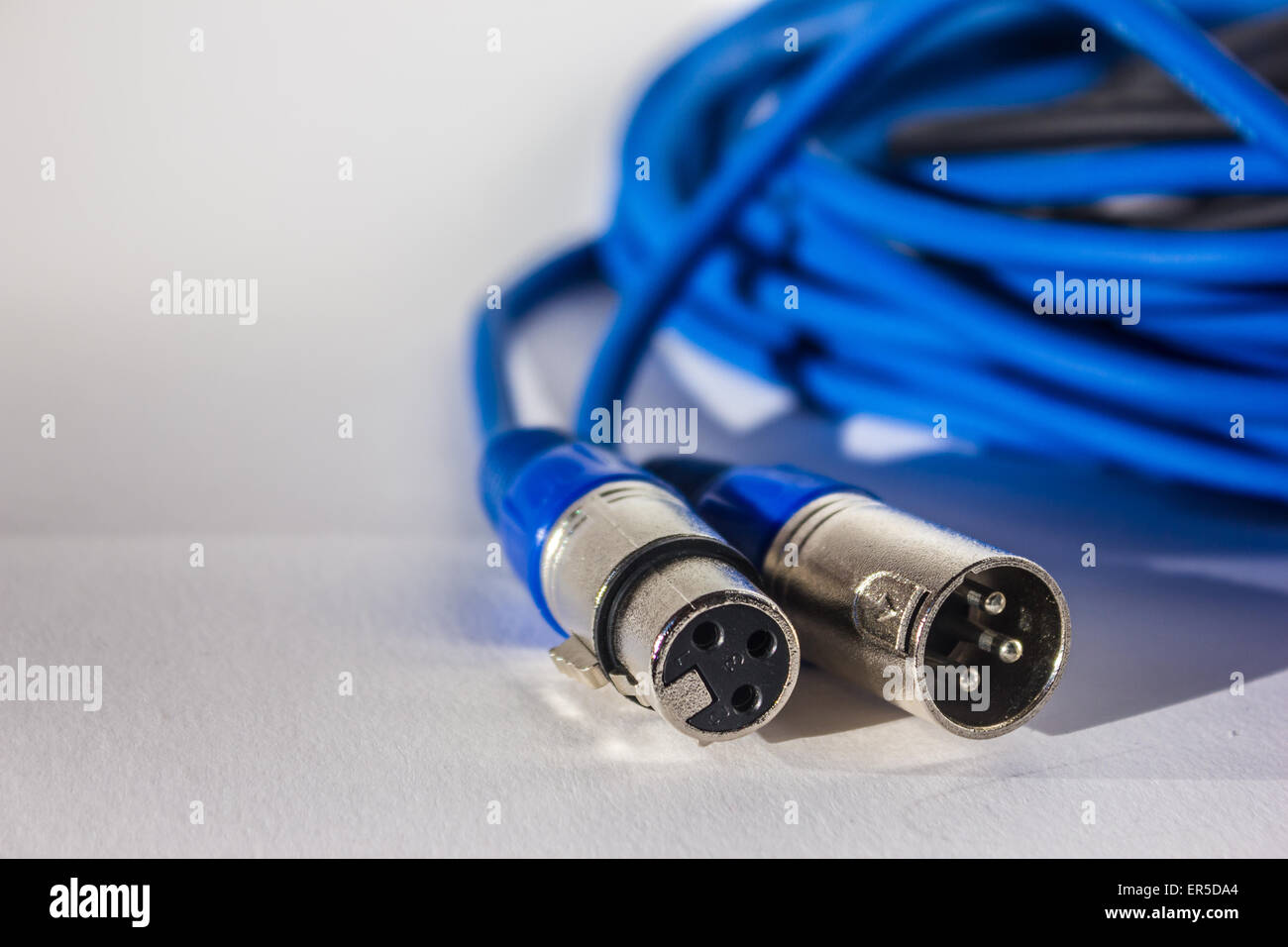XLR cables and connections details. Poster background blue Stock Photo ...