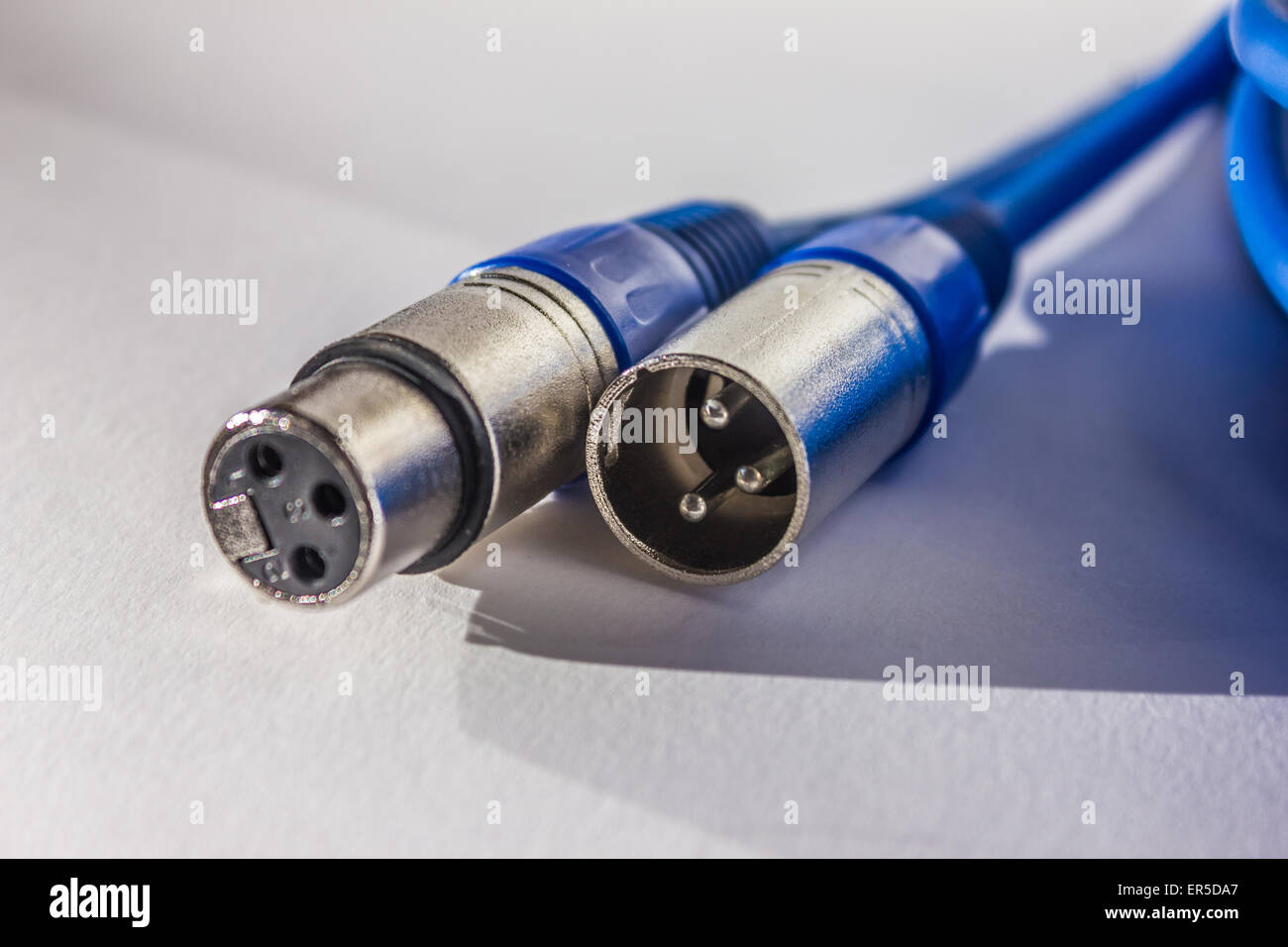 XLR cables and connections details. Poster background blue Stock Photo ...