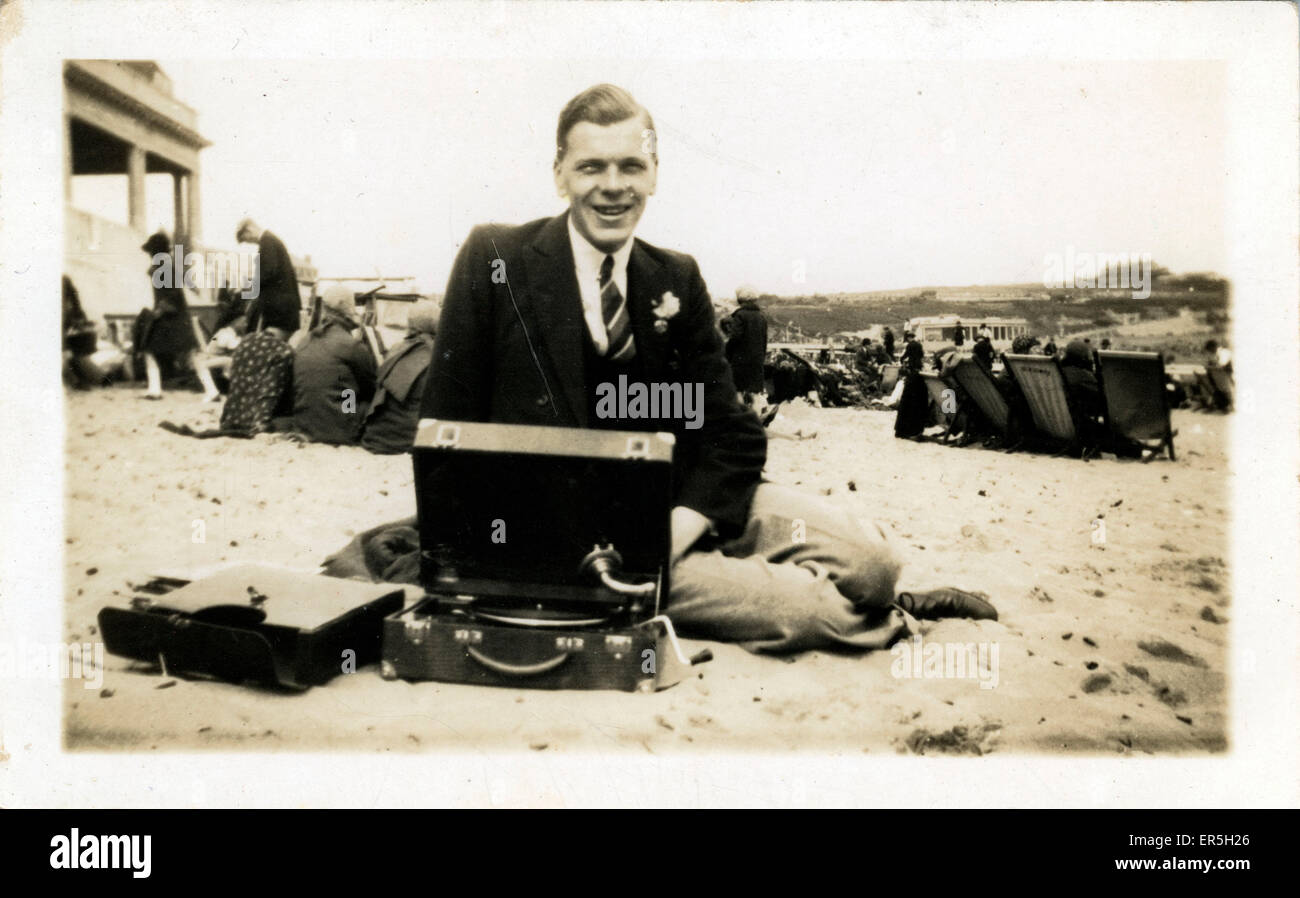 Man at Beach with Portable Gramophone Stock Photo - Alamy