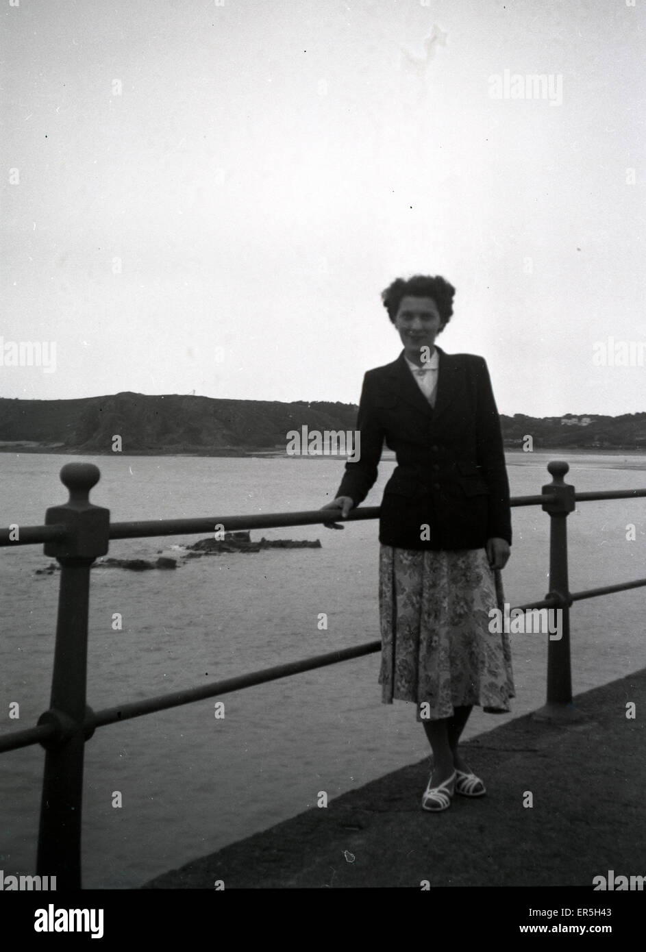 Holidaymaker by Railing, Unknown location Stock Photo - Alamy