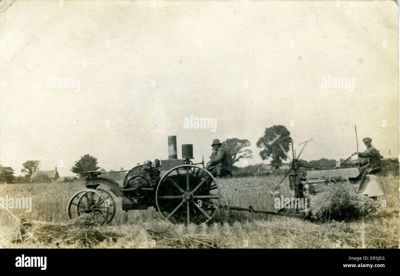 Very Early Tractor & Harvester, Unknown Location Stock Photo - Alamy