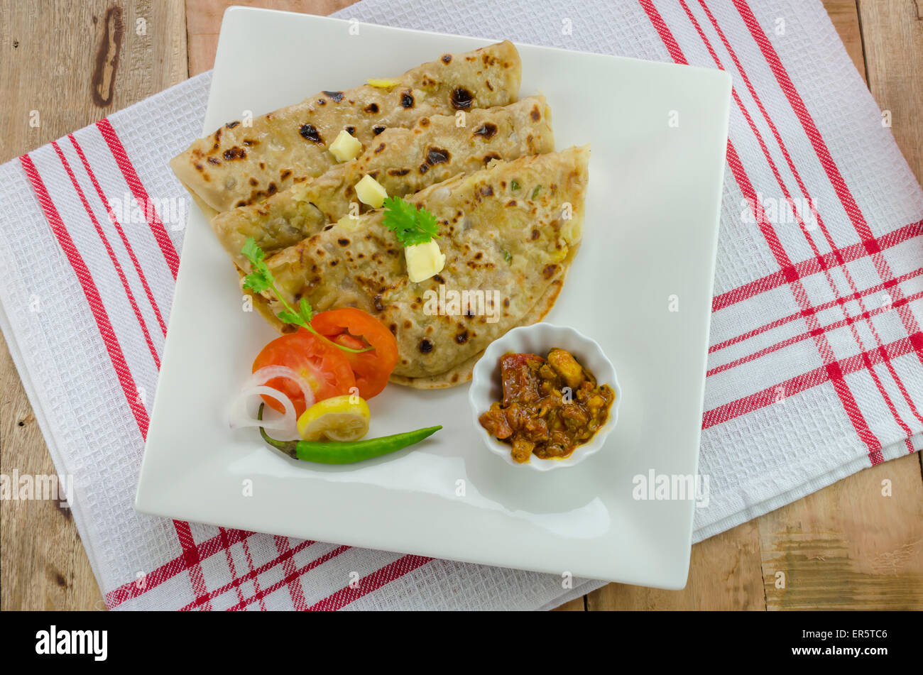 alu paratha with pickle and butter Stock Photo - Alamy