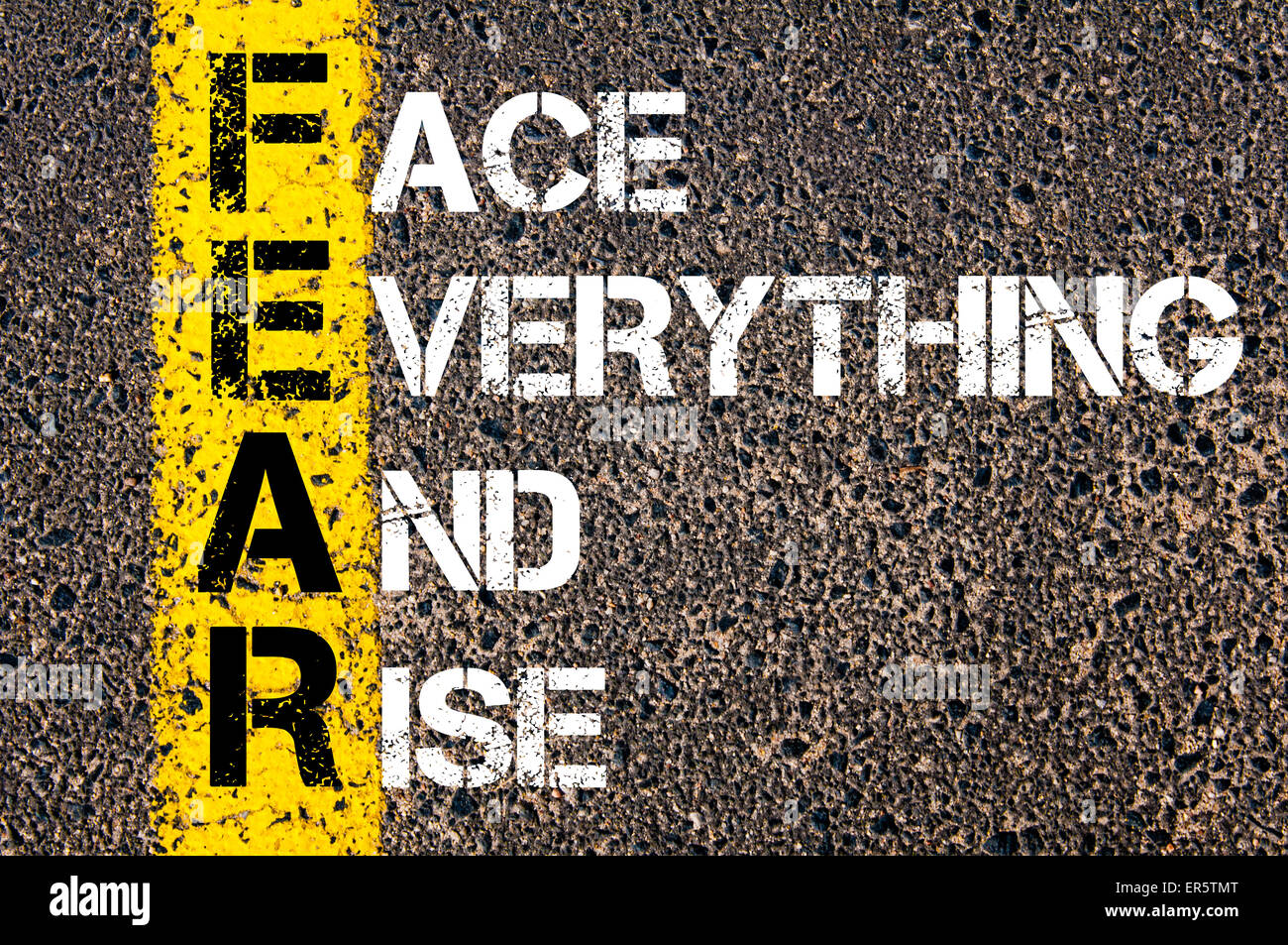 Concept image of Business Acronym FEAR as FACE EVERYTHING AND RISE ...
