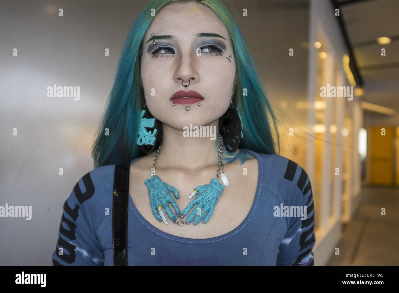 A young girl with her body piercing at Sanlitun, Beijing, China. 27th ...