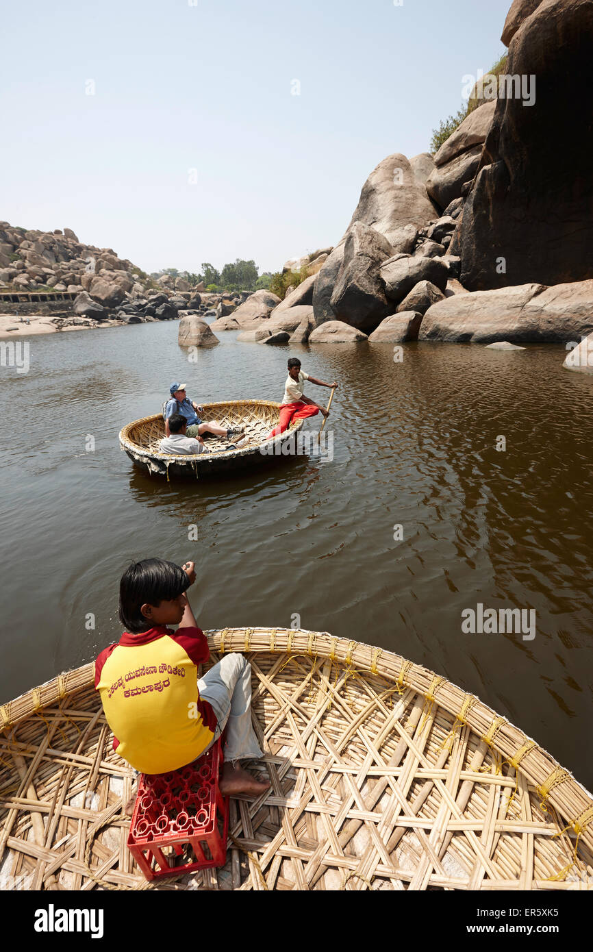 Boattrip in traditional round Coracle rowing boats, Tungabhadra River ...