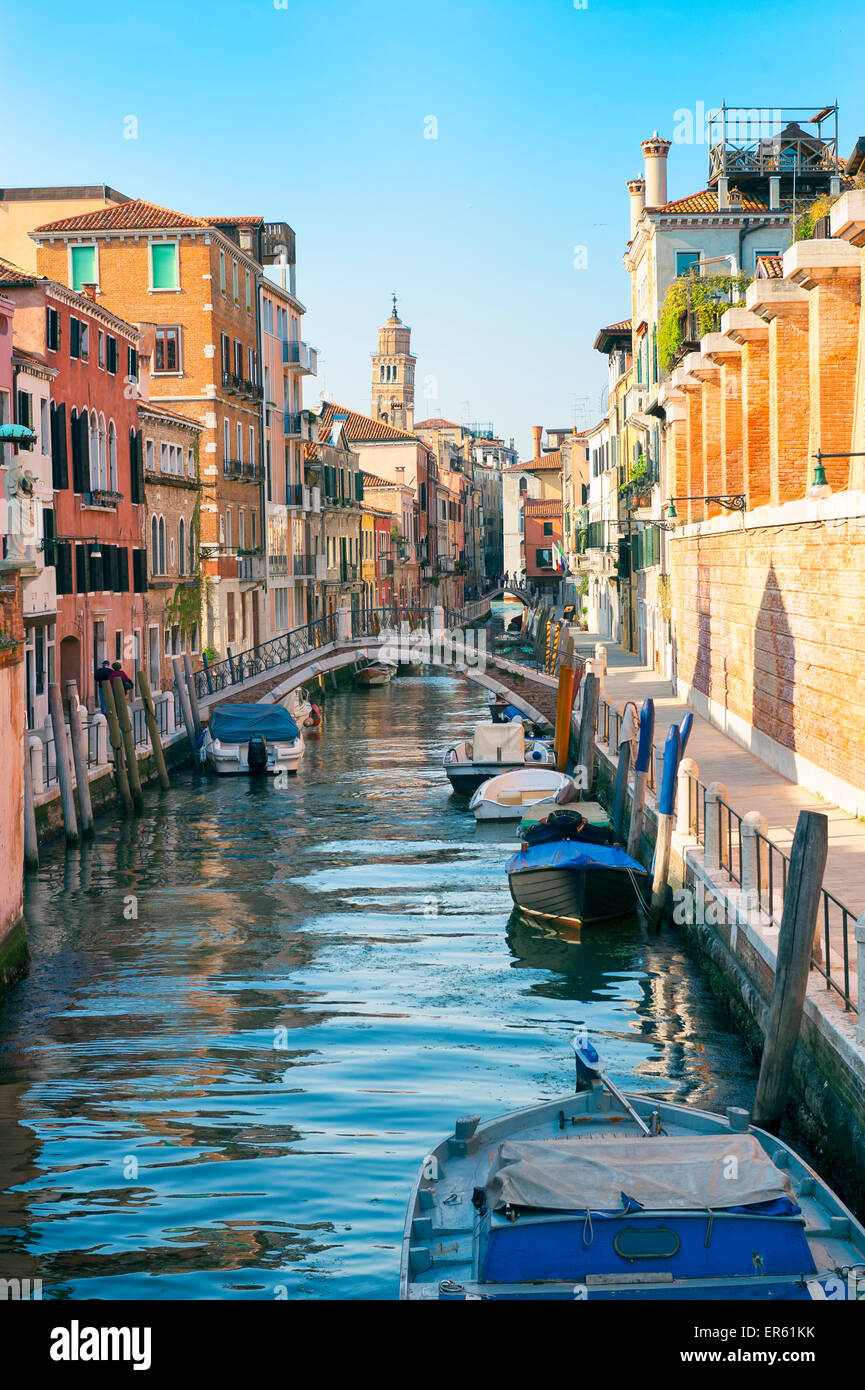 Scenic sunset view of colorful Venetian architecture with bridge over ...
