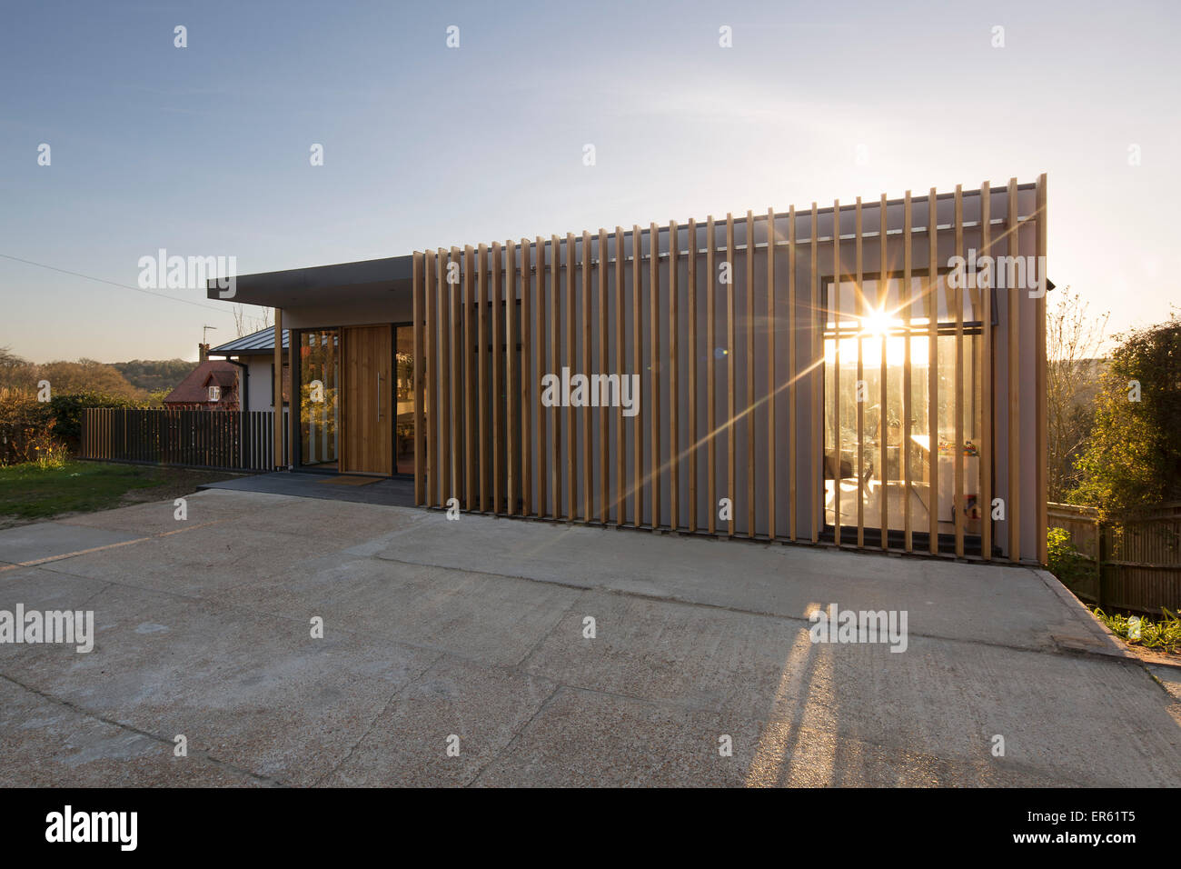 Exterior view front facade with sunset coming thorugh building Upside ...