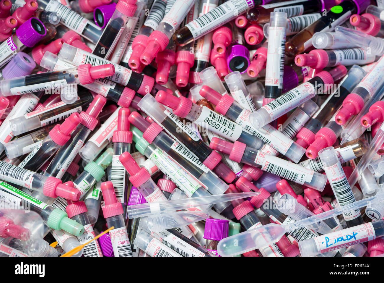 Transparent monovettes containing different blood samples in a garbage ...