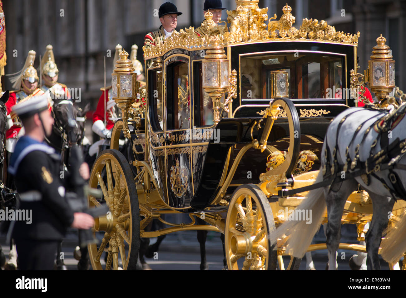 The State Coach with Queen Elizabeth II arrives in Parliament Square ...