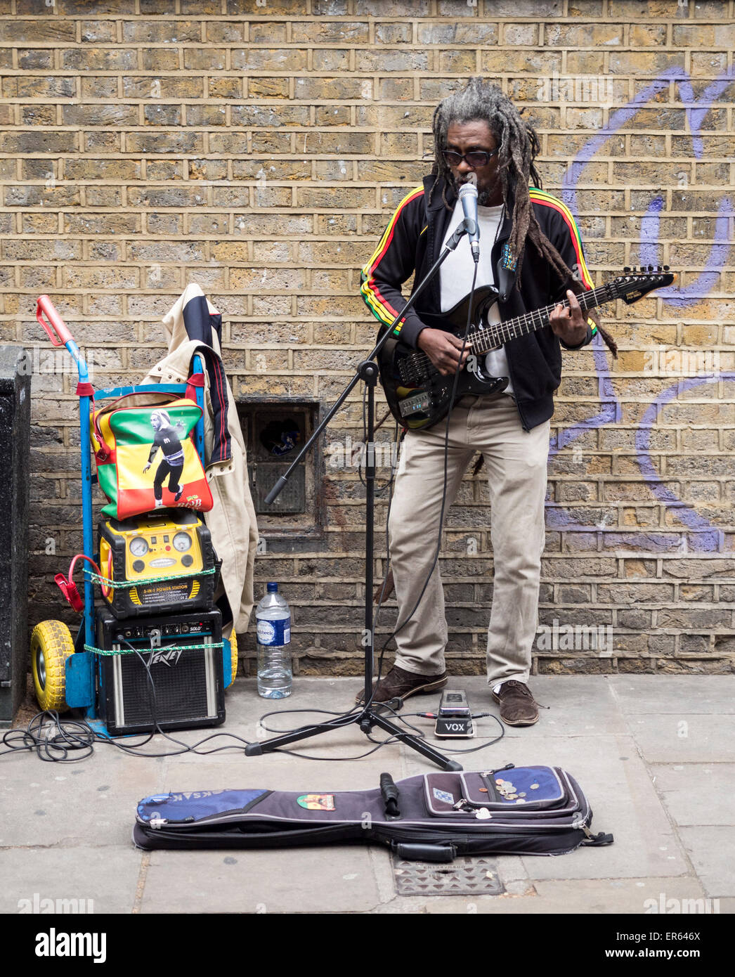 Person busking in Brick Lane, East London Stock Photo - Alamy