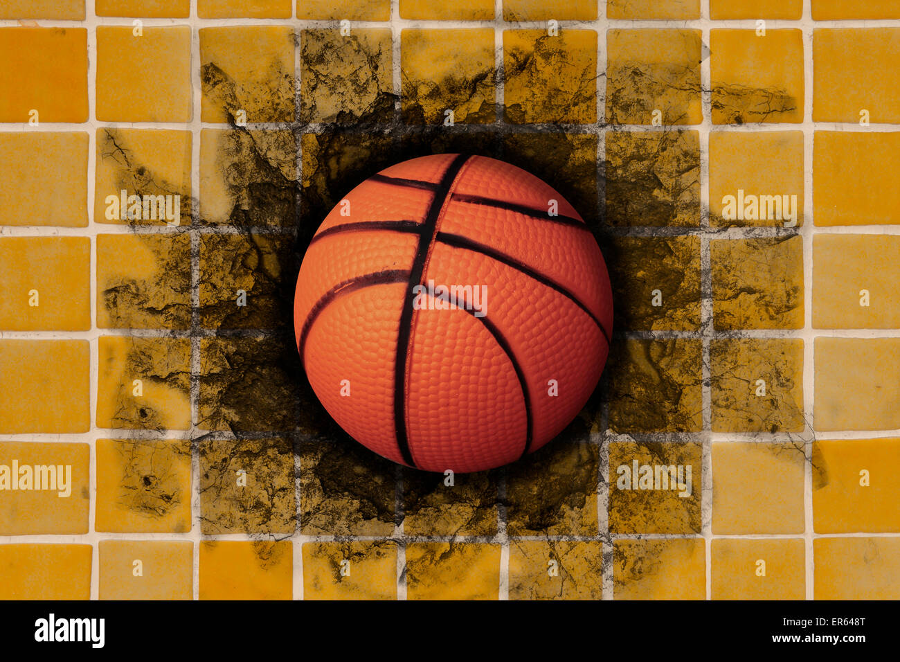 3d rendering of a basket ball embedded in a tiles wall Stock Photo - Alamy