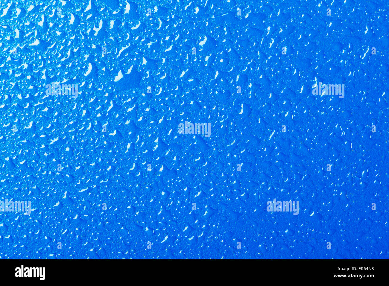 Gradient blue background texture covered with small, real water drops ...