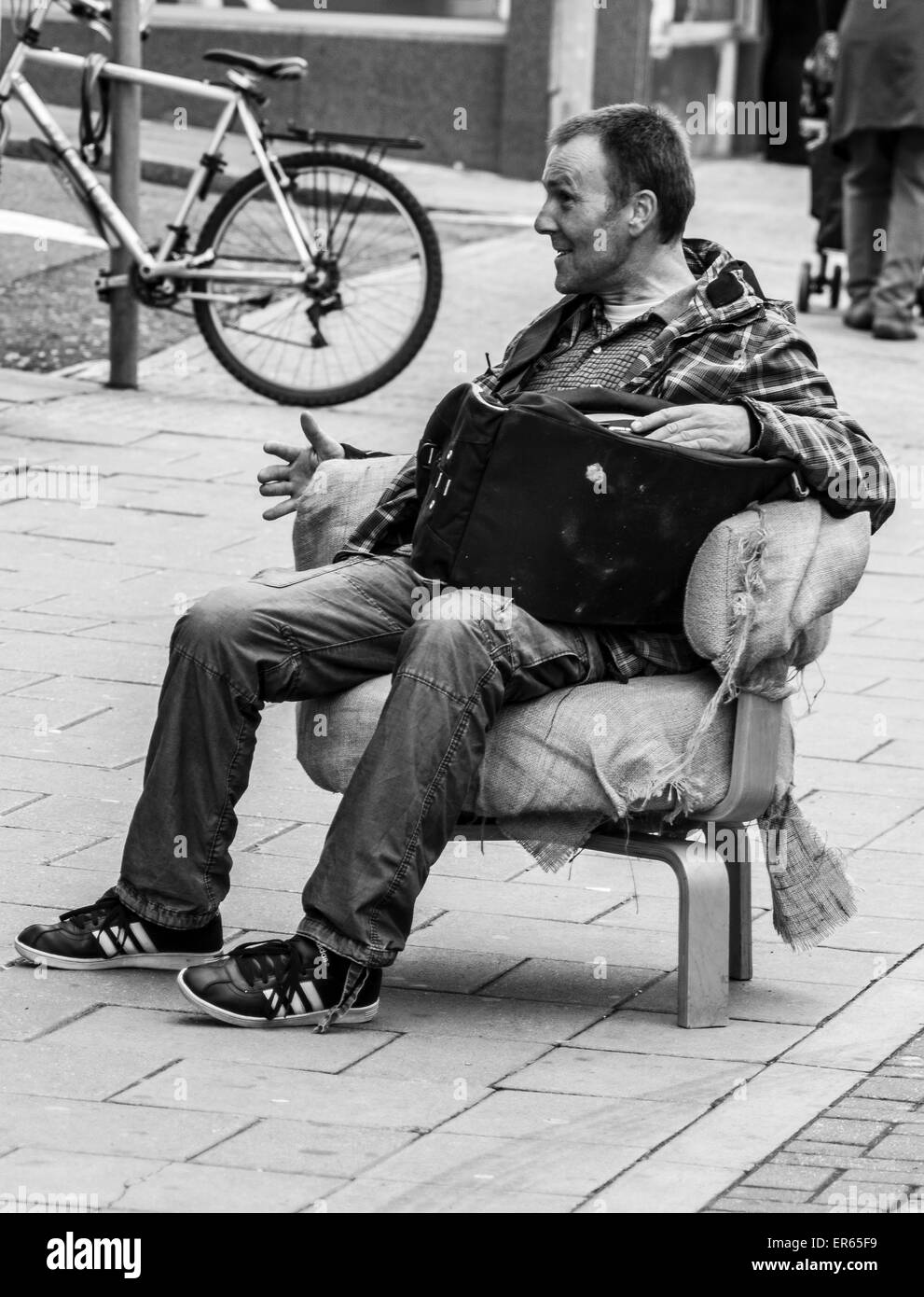 Man on stool in Black and White Stock Photos & Images - Alamy