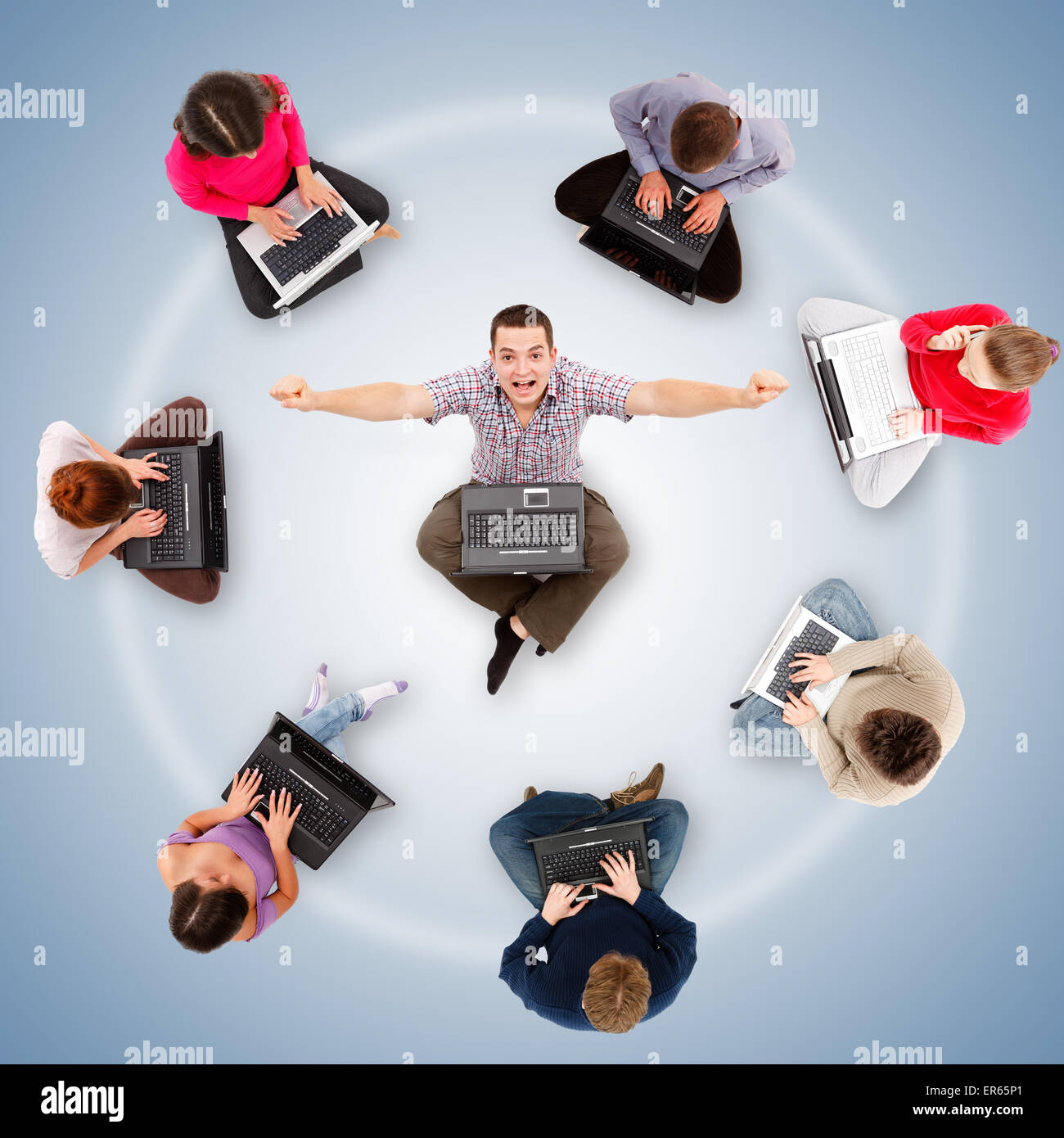 Social network members sitting with their laptop computers around a ...