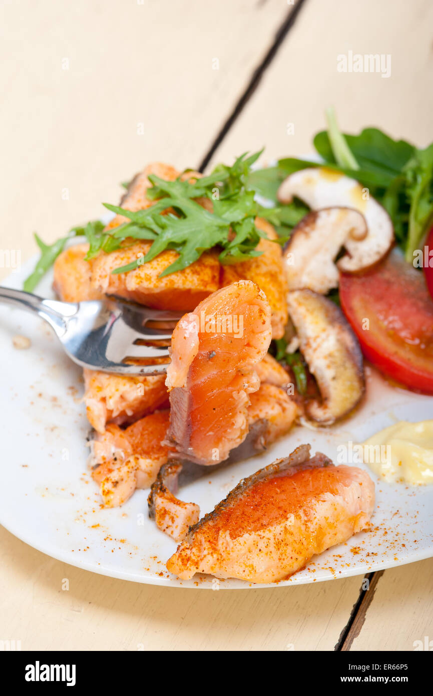 grilled fresh samon filet with vegetables salad tomato arugula ...